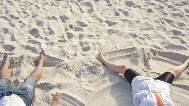 Romantic Couple Making SAND ANGELS. Good Mood Stock Video - Video of ...