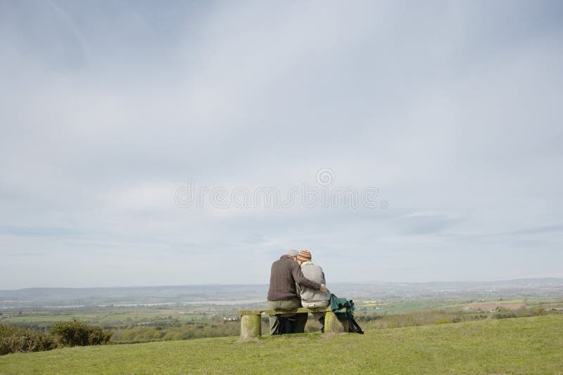 Romantic Couple on Park Bench Stock Image - Image of backpack, park ...