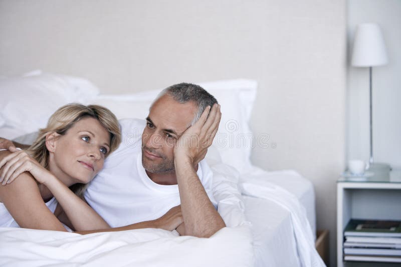 Romantic Couple Relaxing on Bed Stock Image - Image of affectionate ...