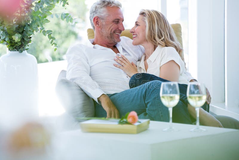 Romantic Couple Sitting on Armchair Stock Photo - Image of adult, focus ...