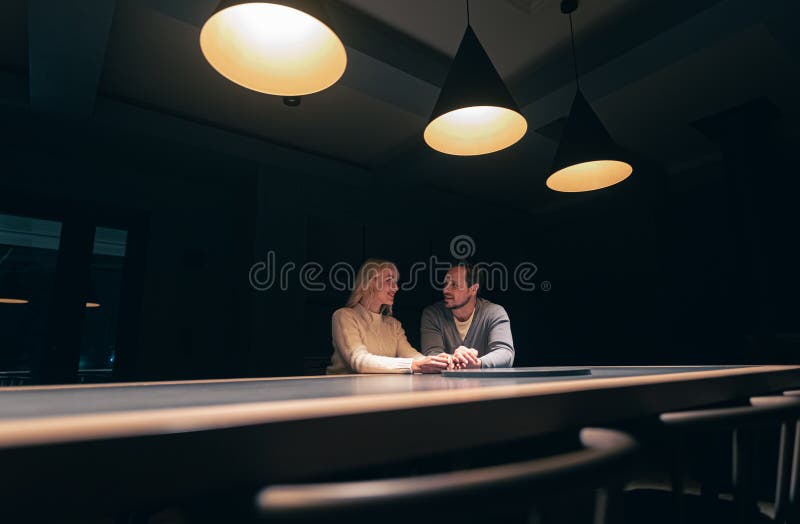 The Romantic Couple Sitting at the Table in Empty Night Restaurant ...