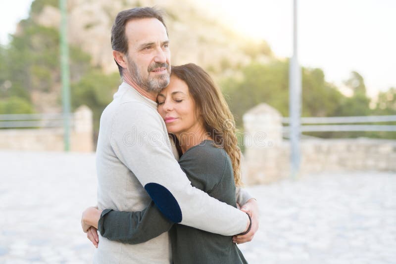 Romantic Couple Smiling, Cuddling and Hugging on a Sunny Day Stock ...