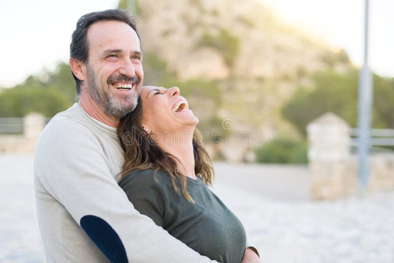 Romantic Couple Smiling, Cuddling and Hugging on a Sunny Day Stock ...