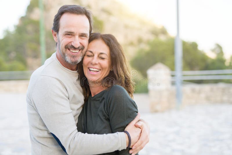 Romantic Couple Smiling and Cuddling on a Sunny Day Stock Photo - Image ...