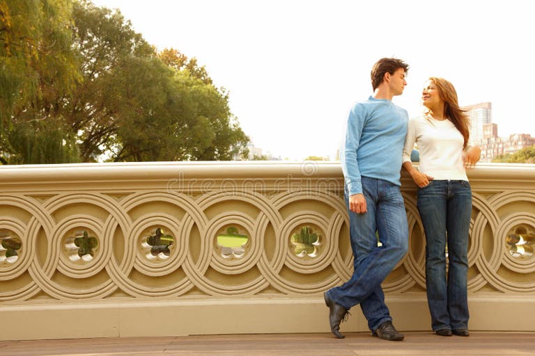 Romantic Couple Standing on Bridge Stock Photo - Image of outdoors ...