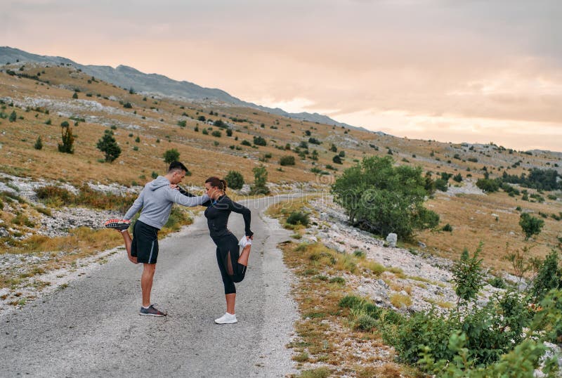 A Romantic Couple Stretching Down after a Run Stock Image - Image of ...