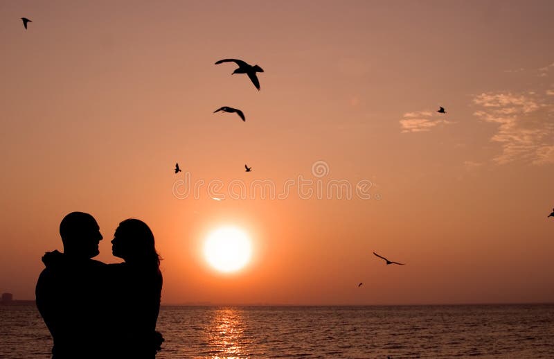 Romantic couple at sunset stock image. Image of attachment - 330089
