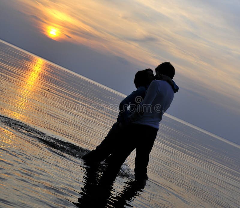 Romantic couple at sunset stock photo. Image of evening - 6629460