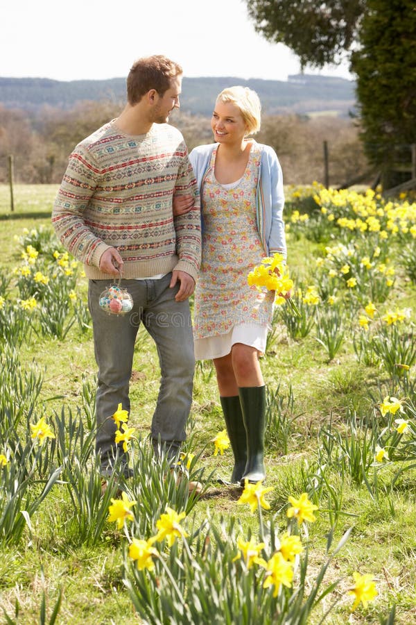 Romantic Couple Walking Amongst Spring Daffodils Stock Photo - Image of ...