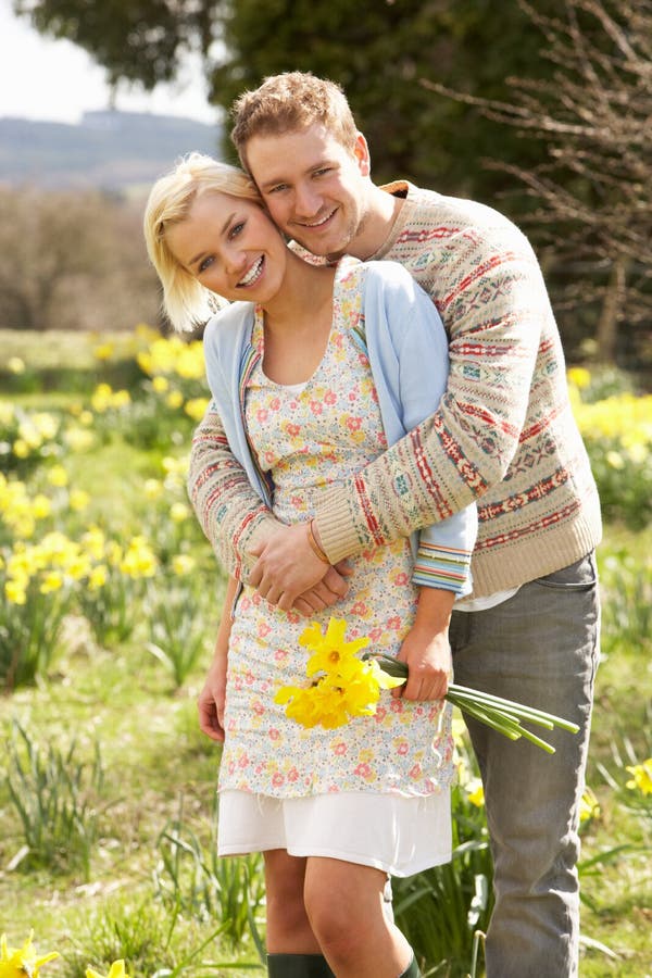 Romantic Couple Walking Amongst Spring Daffodils Stock Photo - Image of ...