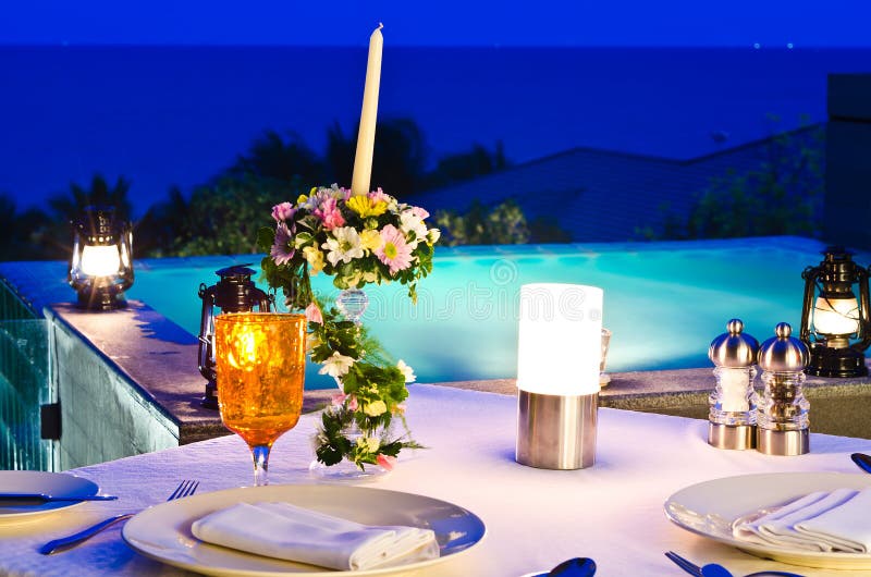 Romantic Dinner Set Up Table Near Pool Stock Photo - Image of romance ...
