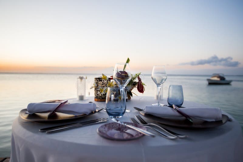 Romantic Dinner Setting on the Beach at Sunset. Stock Image - Image of ...
