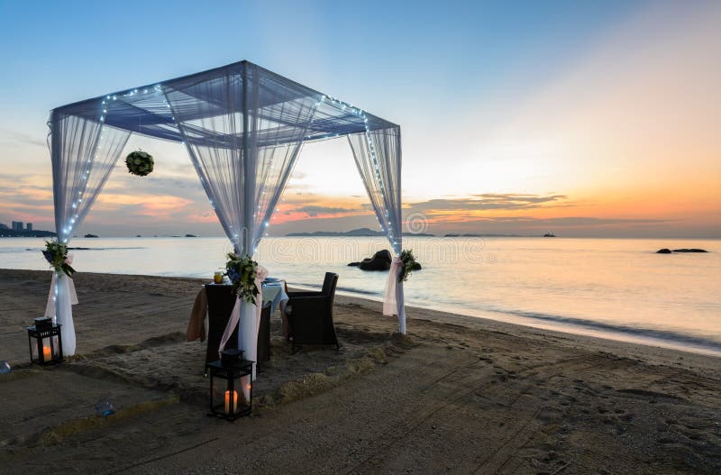 Romantic Dinner Setup on Beach at Sunset Stock Image - Image of dining ...