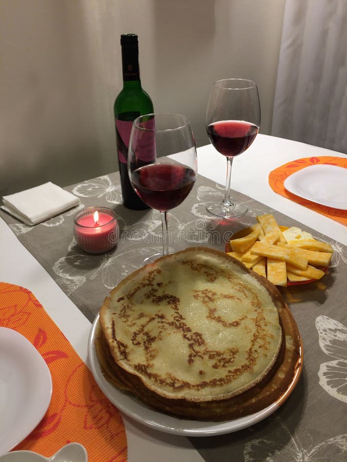 Romantic Dinner Table Setting with Wine, Cheese, Pancakes, Candles and ...