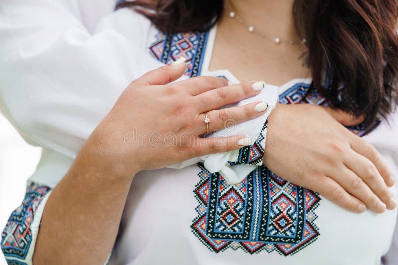 Romantic Embrace Featuring Elegantly Adorned Hands in Traditional ...