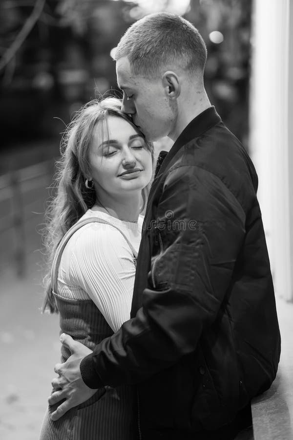 Romantic Embrace of a Young Couple in Black and White at Night Stock ...