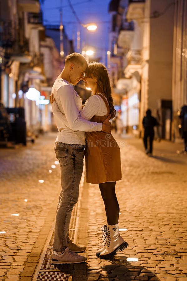 Romantic Evening Embrace on a Cobblestone Street Stock Photo - Image of ...