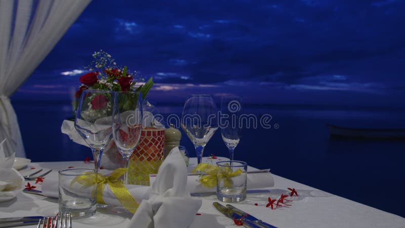 Romantic Evening Table for Two Persons on the Beach at Sunset on the ...
