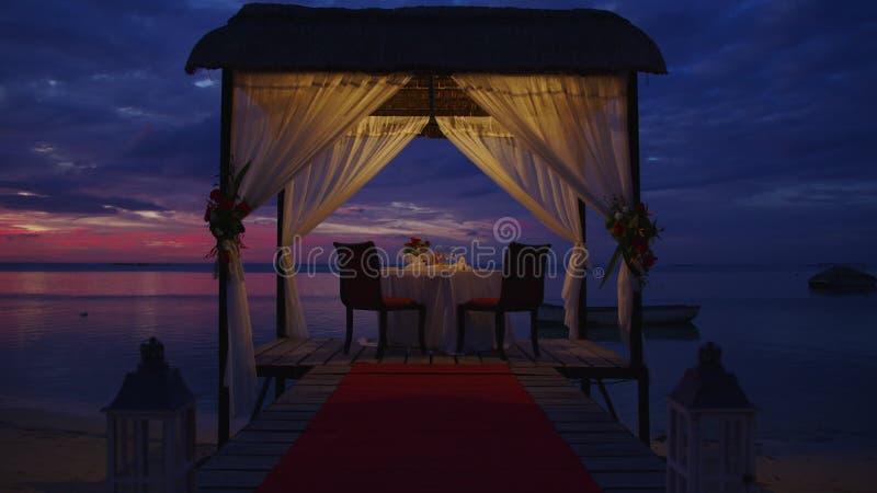 Romantic Evening Table for Two Persons on the Beach at Sunset on the ...