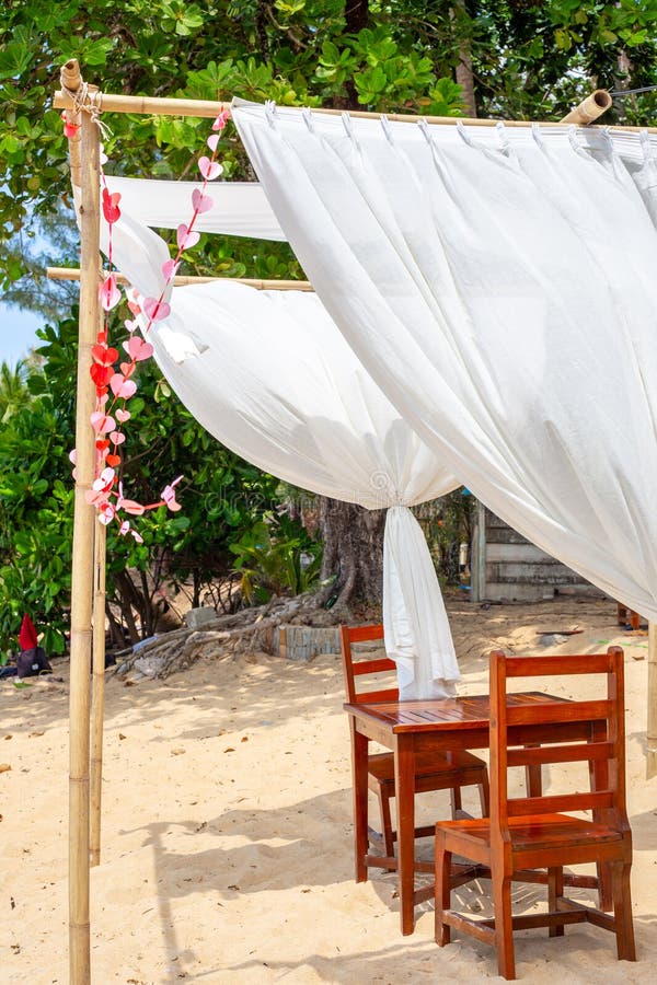 Romantic Gazebo with White Canopy, Table and Chairs on the Shore of a ...