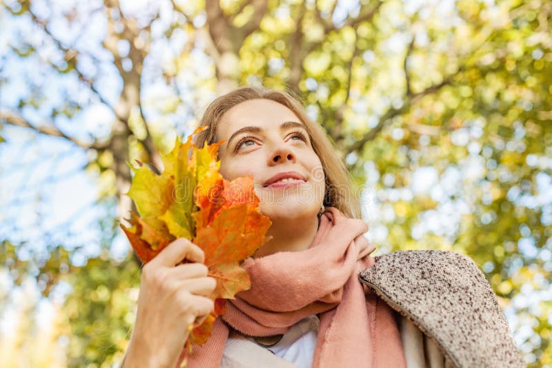 Romantic Girl Dreams In Autumn Fall Park Cute Young Woman Holding