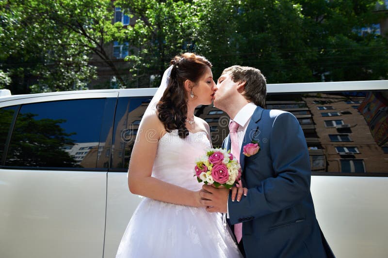 Romantic Kiss of Bride and Groom Stock Photo - Image of sunny, roses ...