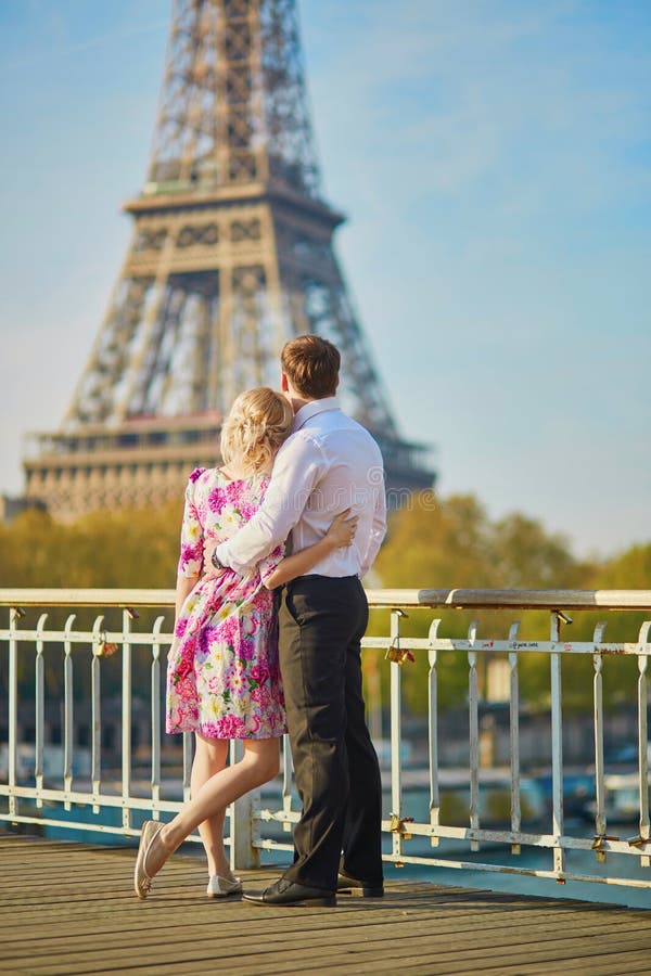 Romantic Couple Kissing Near The Eiffel Tower In Paris France Stock