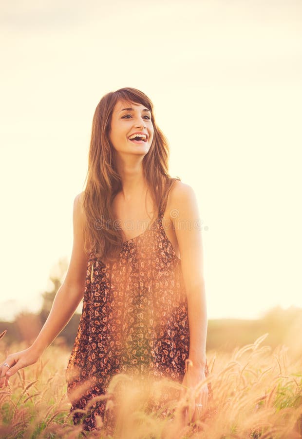 Romantic Model in Sun Dress in Golden Field at Sunset Stock Image ...