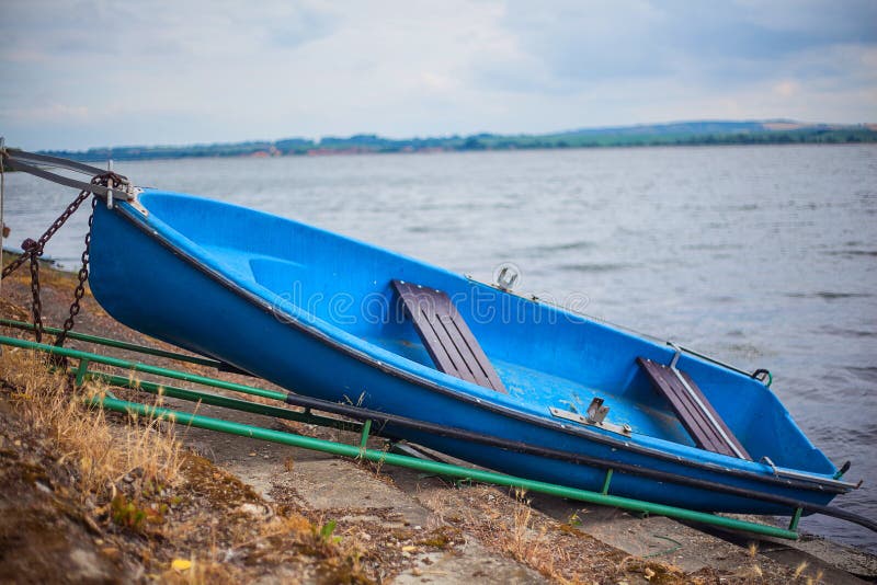 Romantic old boat on shore stock image. Image of grass - 61277167