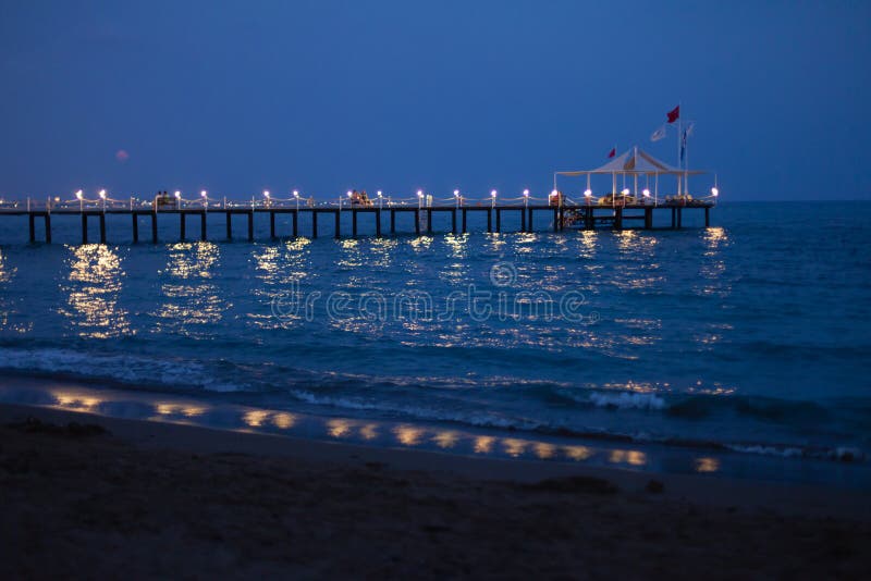 Romantic pier at night stock image. Image of dusk, relaxation - 94772505