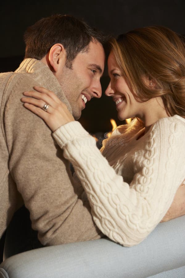 Romantic Portrait Couple in Front of Fire Stock Photo - Image of loving ...