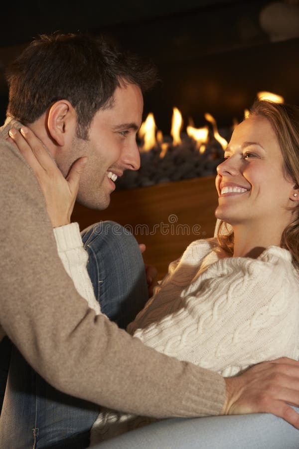 Romantic Portrait Couple in Front of Fire Stock Photo - Image of ...