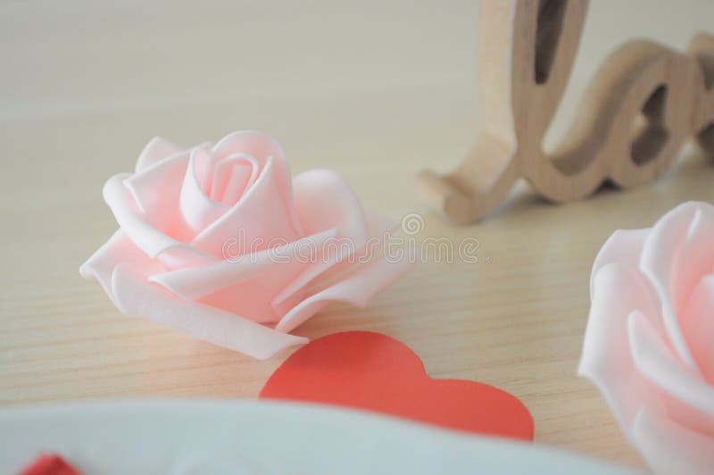 Roses Next To Plate on the Table Stock Photo - Image of plant, flower ...