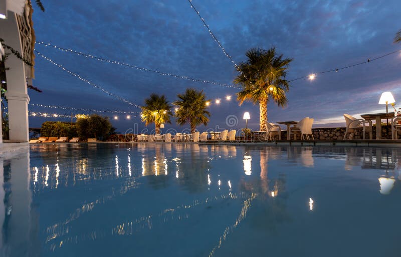 Romantic Restaurant by the Pool at Night Stock Image - Image of patio ...
