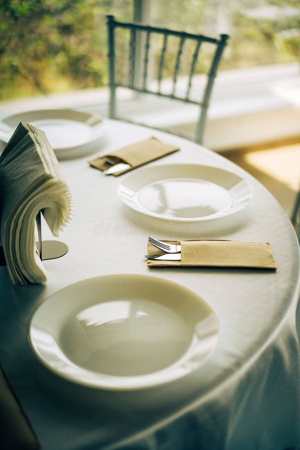 Restaurant Table Setting with White Plate and Cutlery Stock ...