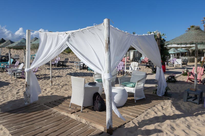 White Canopy Setup for Beach Wedding Ceremony with Chairs and ...