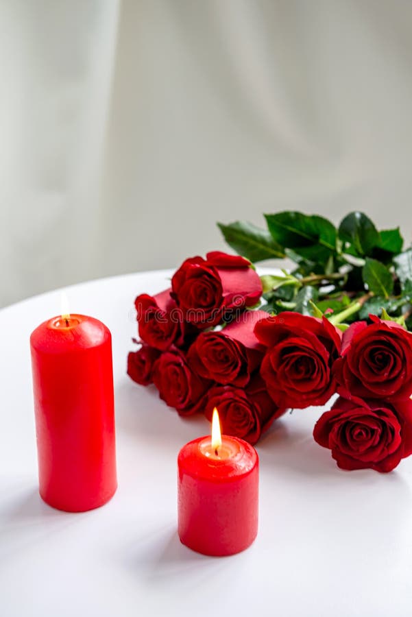 Romantic Still Life, There are Two Red Burning Candles and a Bouquet of ...