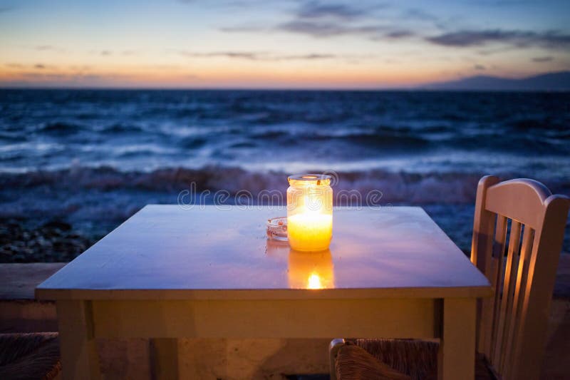 Romantic Table with Burning Candle by the Sea at Night Stock Image ...