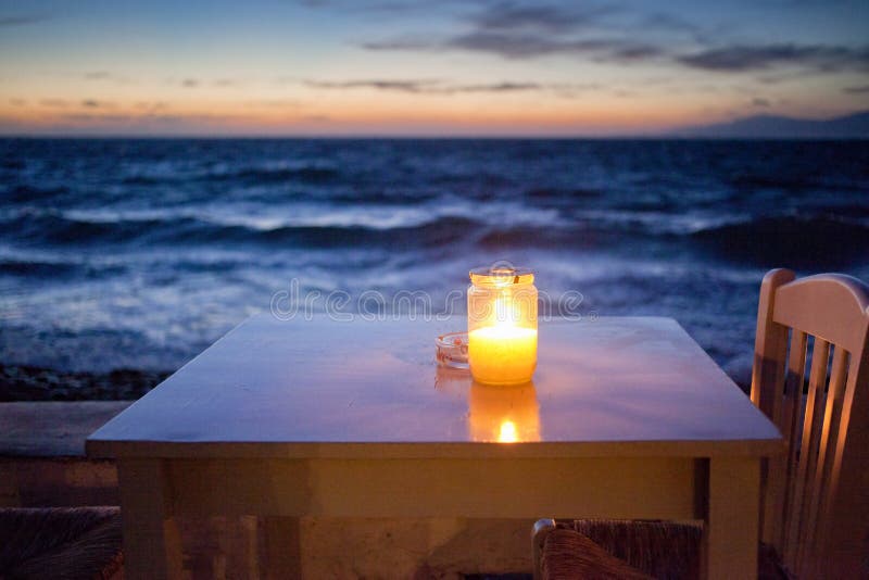 Romantic Table with Burning Candle by the Sea at Night Stock Photo ...
