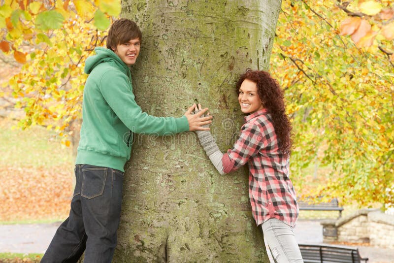 Romantic Teenage Couple by Tree Stock Image - Image of colourful ...