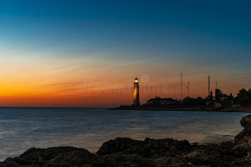 Romantic View of Lighthouse from the Cliff at Sunset Stock Image ...