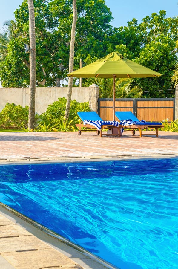 Romantic View of Two Sunbeds at Swimming Pool Stock Image - Image of ...