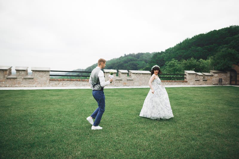 Romantic Wedding Moment, Bride Running from Groom in a Park Stock Image ...