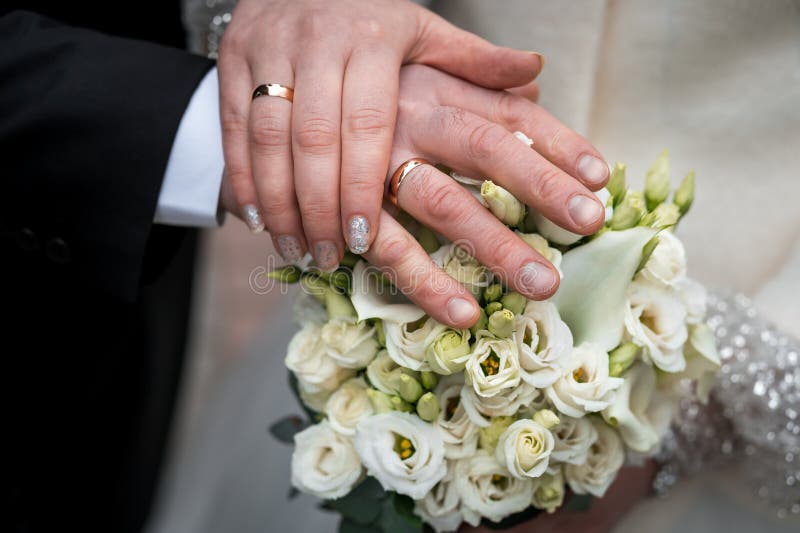 Romantic Wedding Rings and Bouquet Close-Up for Celebrating Love and ...