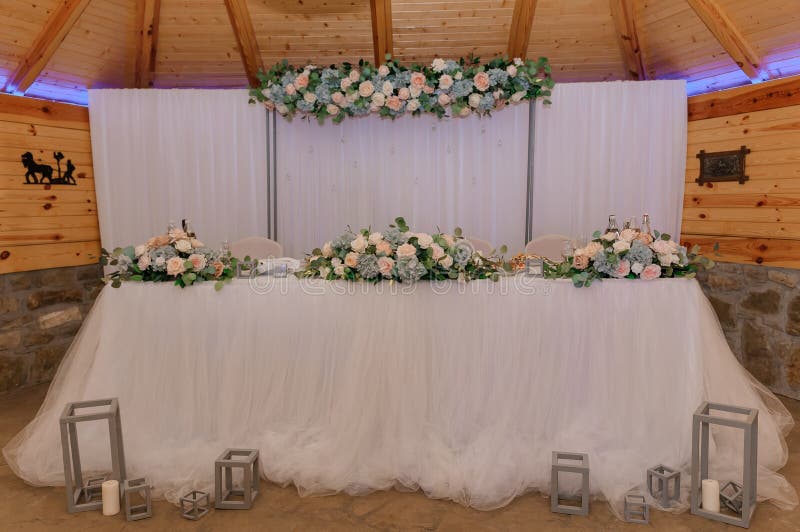 Romantic Wedding Setup in Rustic Log Cabin with Floral Arch and Table ...