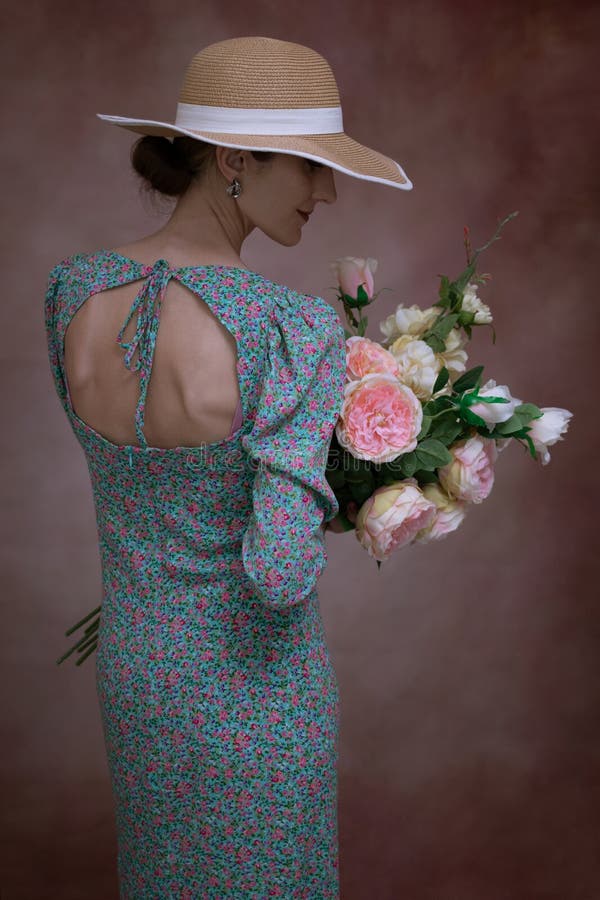 Romantic Woman in Hat with Bouquet of Flowers.Art Processing Stock ...