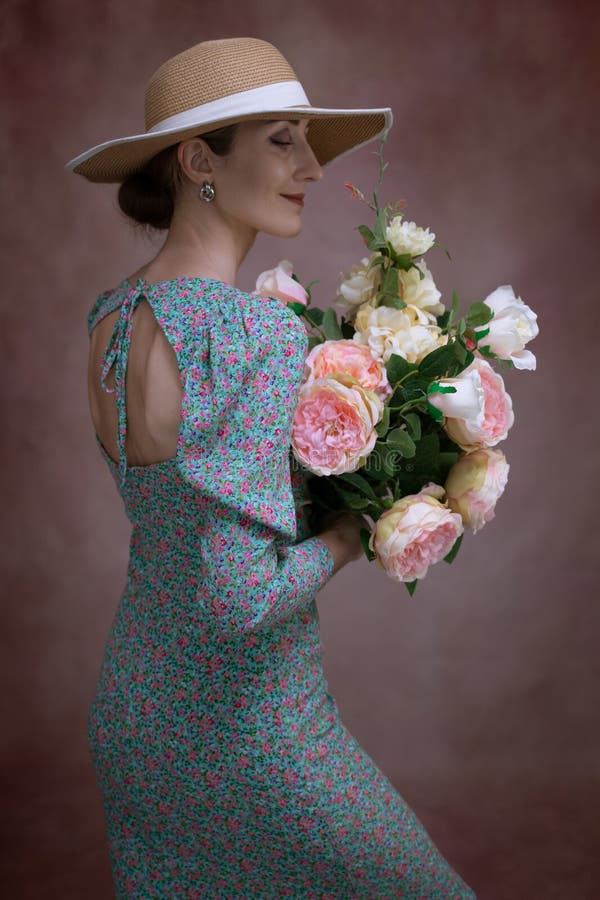 Romantic Woman in Hat with Bouquet of Flowers.Art Processing Stock ...