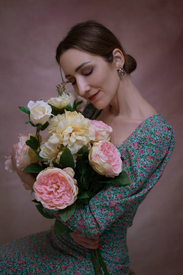 Romantic Woman in Hat with Bouquet of Flowers.Art Processing Stock ...