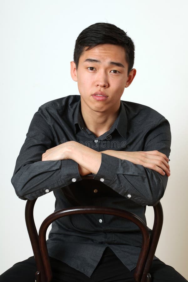 Romantic Young Asian Man Sitting On A Chair Stock Image - Image of ...