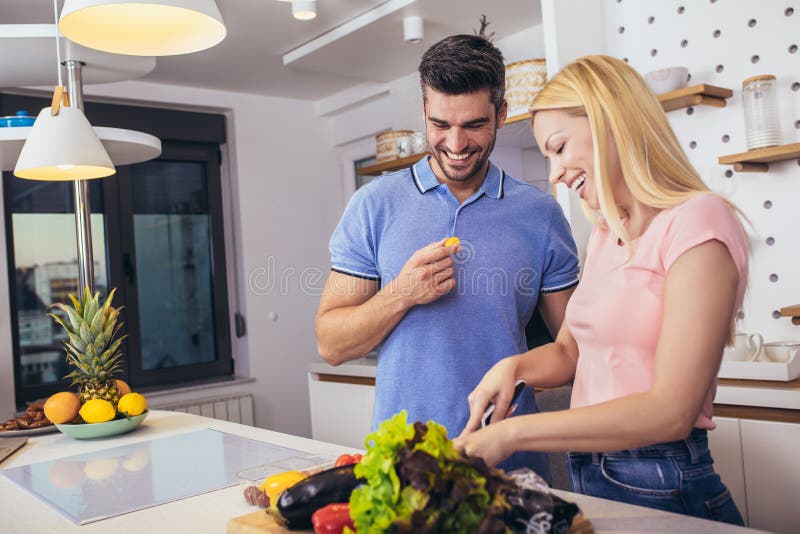 Young Couple Cooking Together in the Kitchen,having a Great Time ...